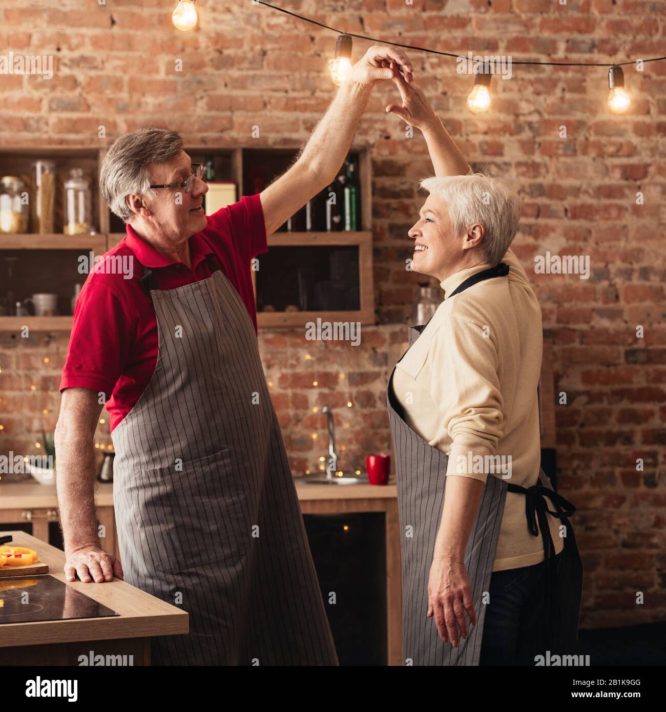 Woman dancing in kitchen hi-res stock photography and images - Alamy