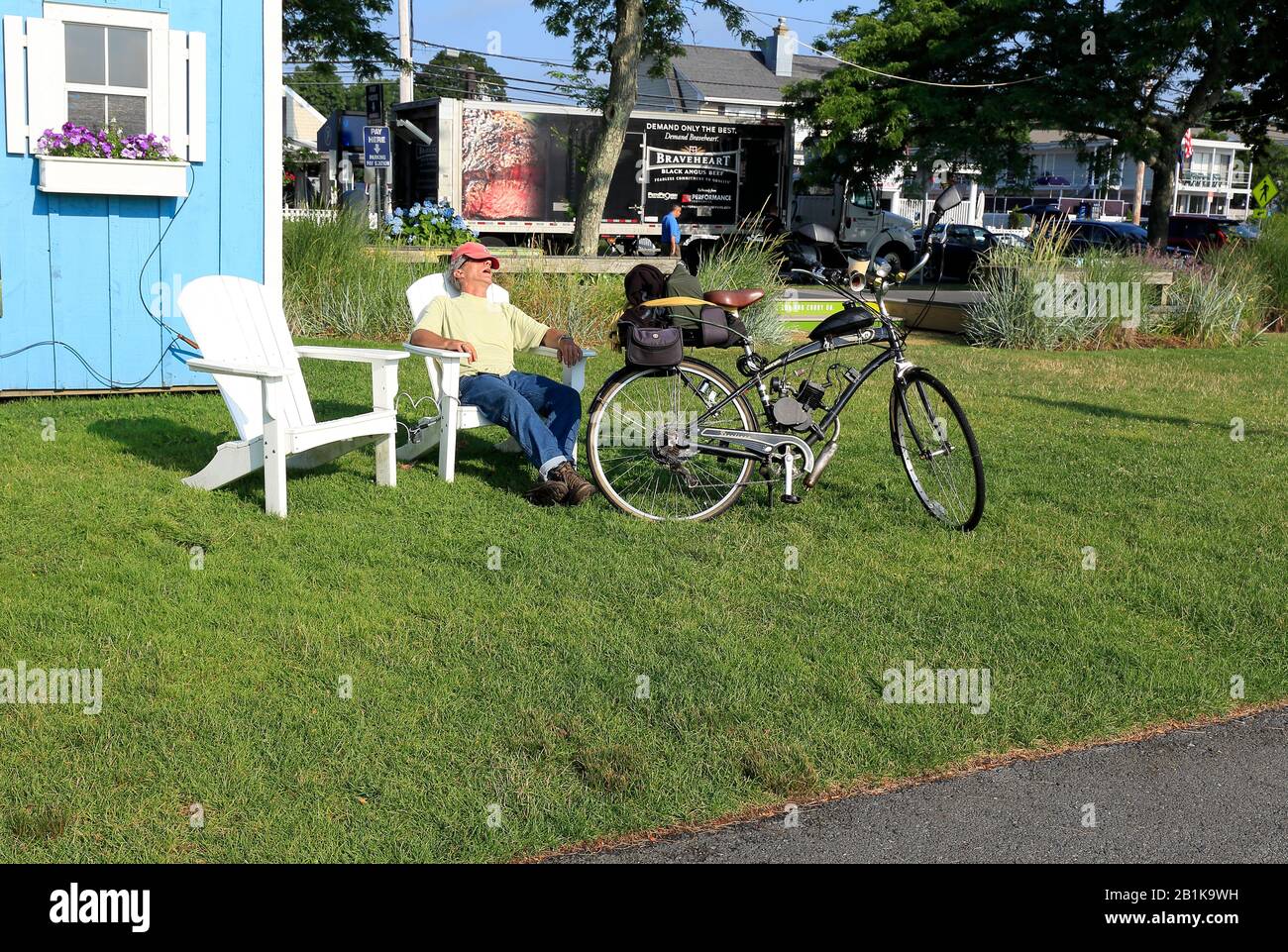 Man snoozing in deck chair outside artist's shack Stock Photo - Alamy