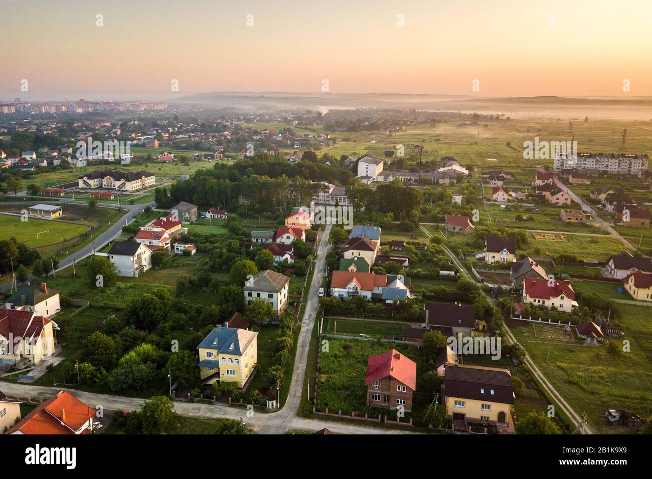 Aerial landscape of small town or village with rows of residential ...