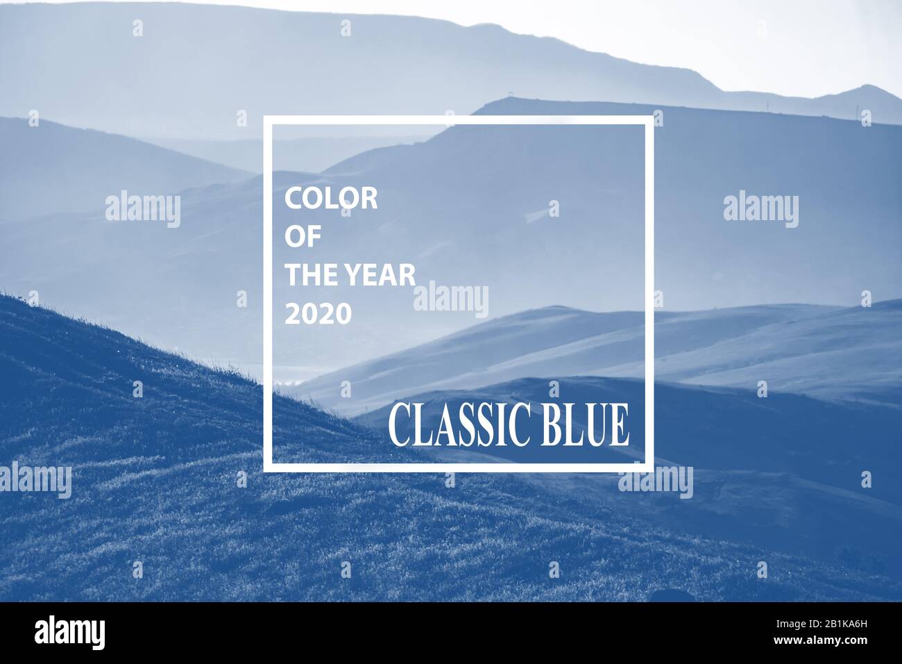 low mountains in mist colored in trendy Classic Blue pantone color of ...