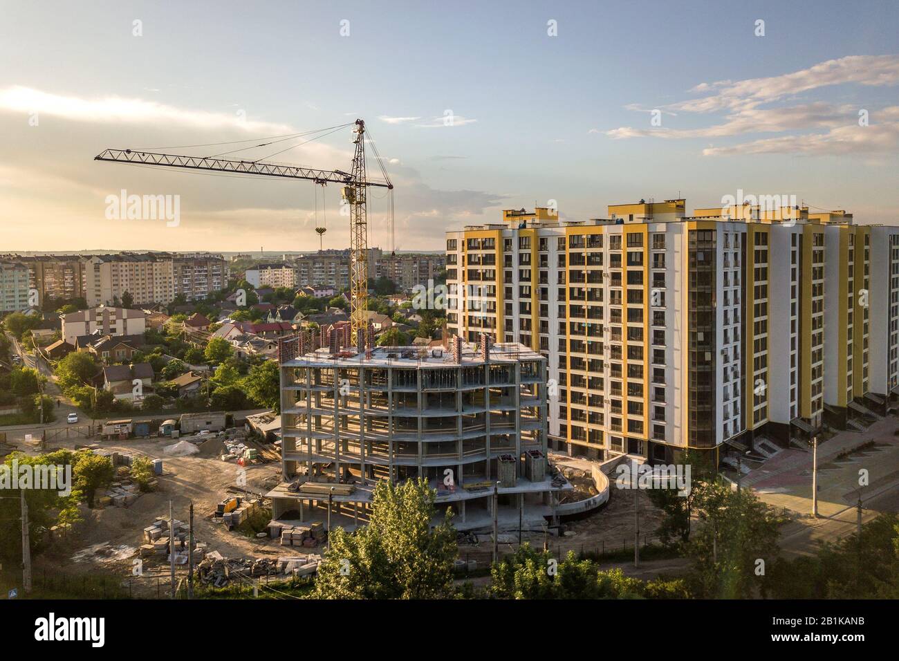 Apartment or office tall building under construction. Brick walls ...