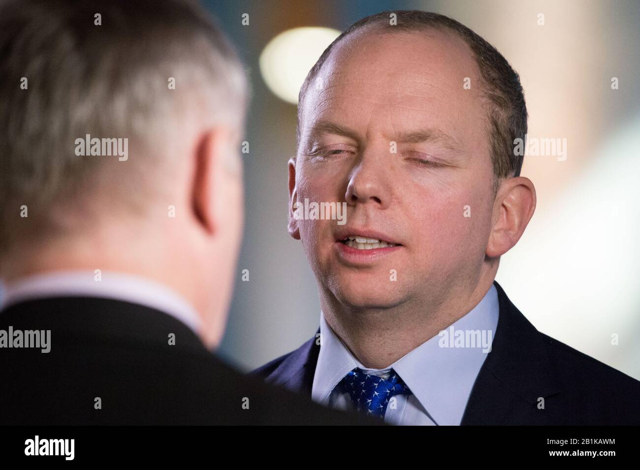 Donald cameron with eyes closed during tv interview hi-res stock ...