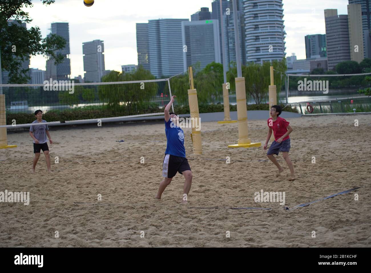 Few Children are playing Volleyball on sand Stock Photo - Alamy