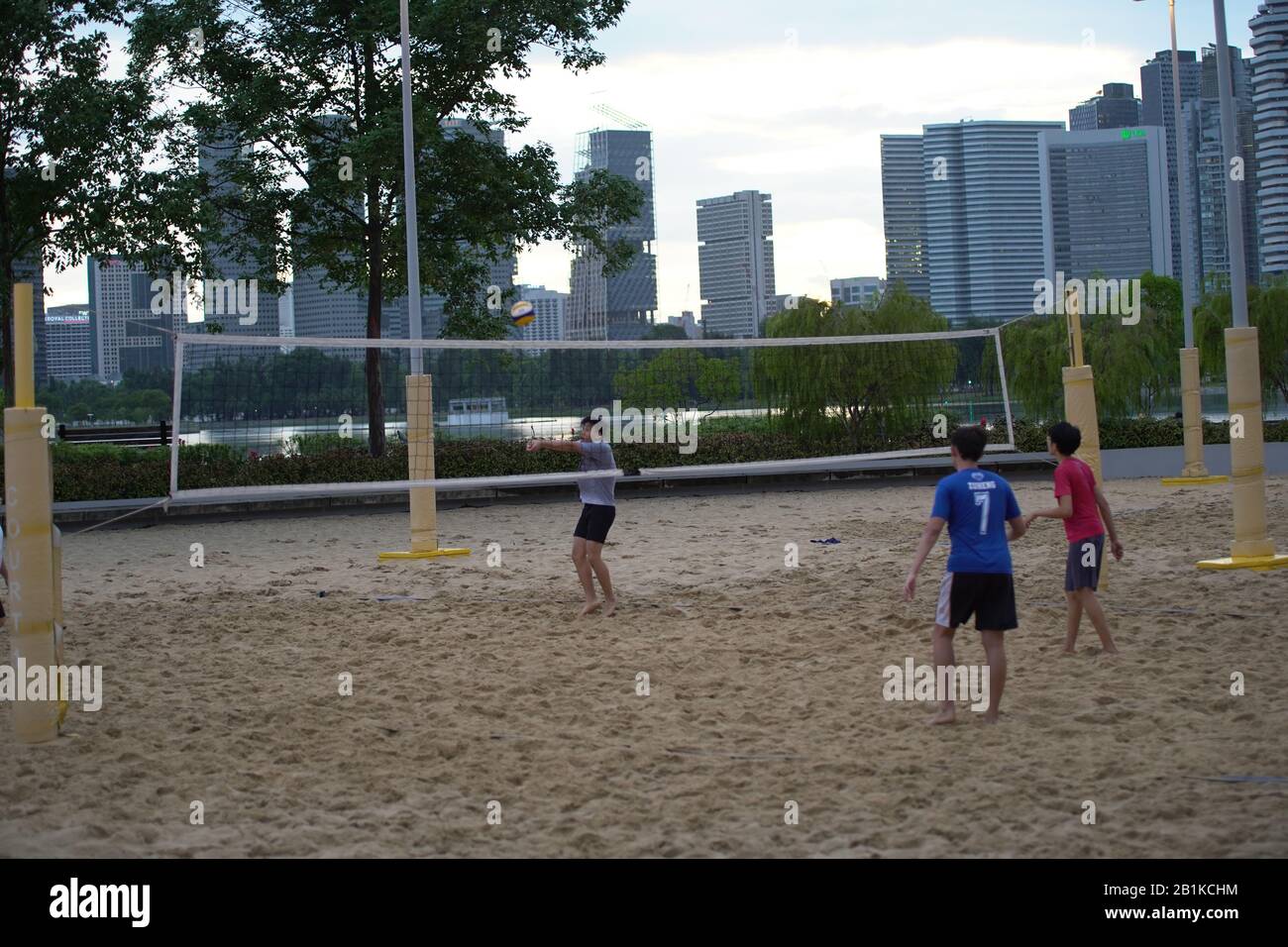 Few Children are playing Volleyball on sand Stock Photo - Alamy