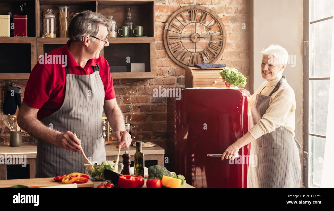 Retired Couple Enjoying Meal At Home High Resolution Stock Photography ...