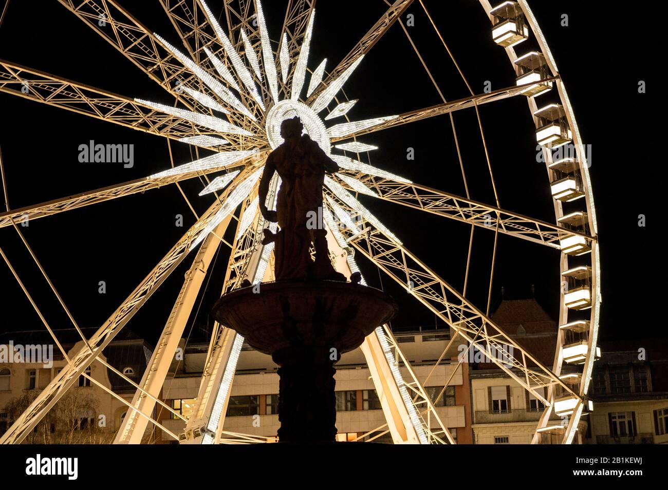 Budapest Eye ferris wheel at night with Danube fountain figure Stock ...