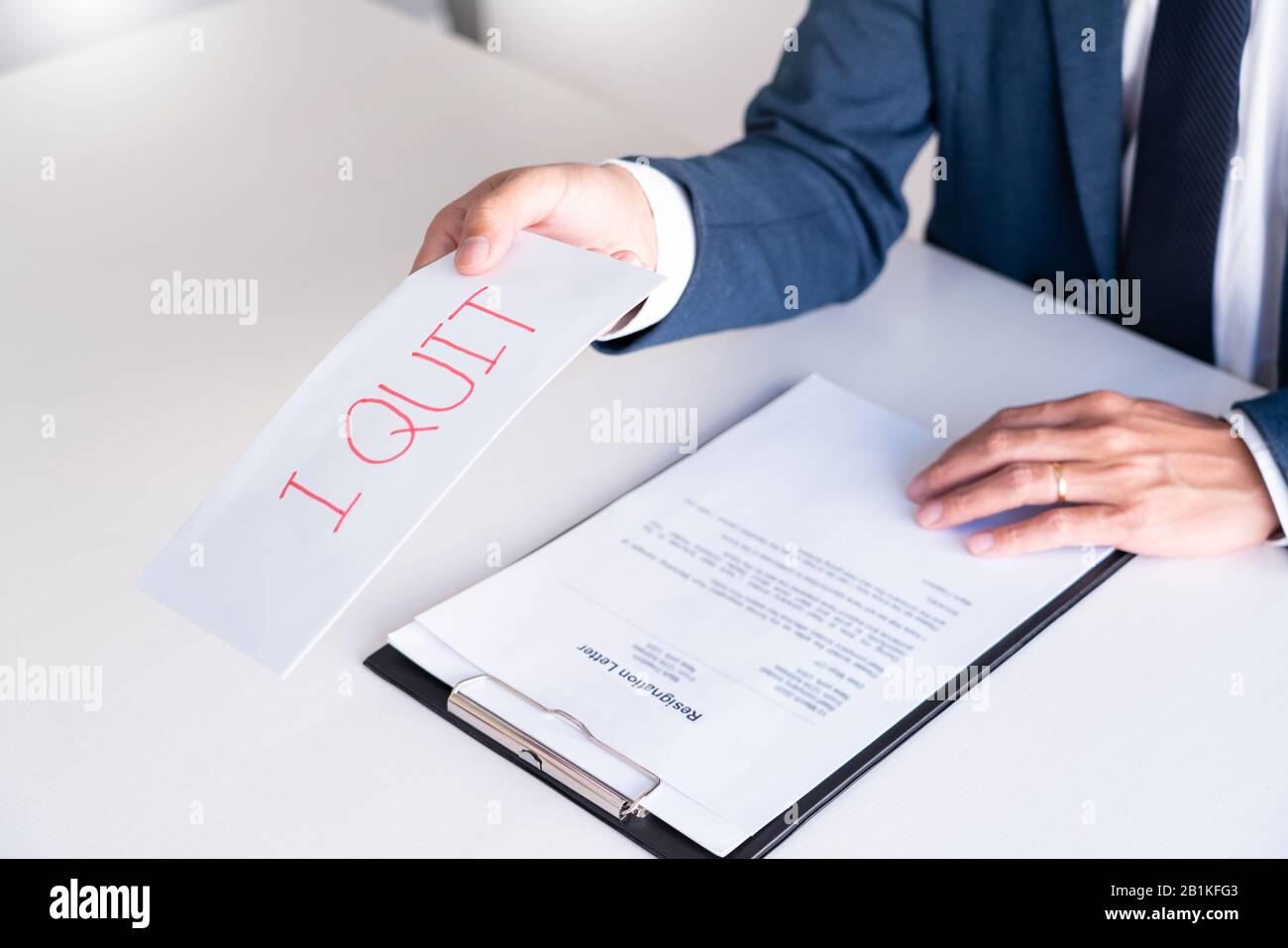 Businessman holding with I quit words card letter, resign employee ...