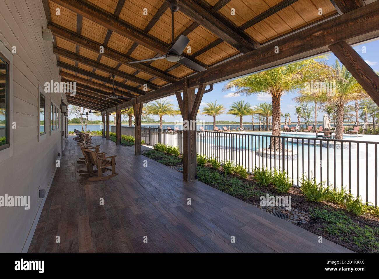 View form the porch of a recreational clubhouse to a community pool of ...