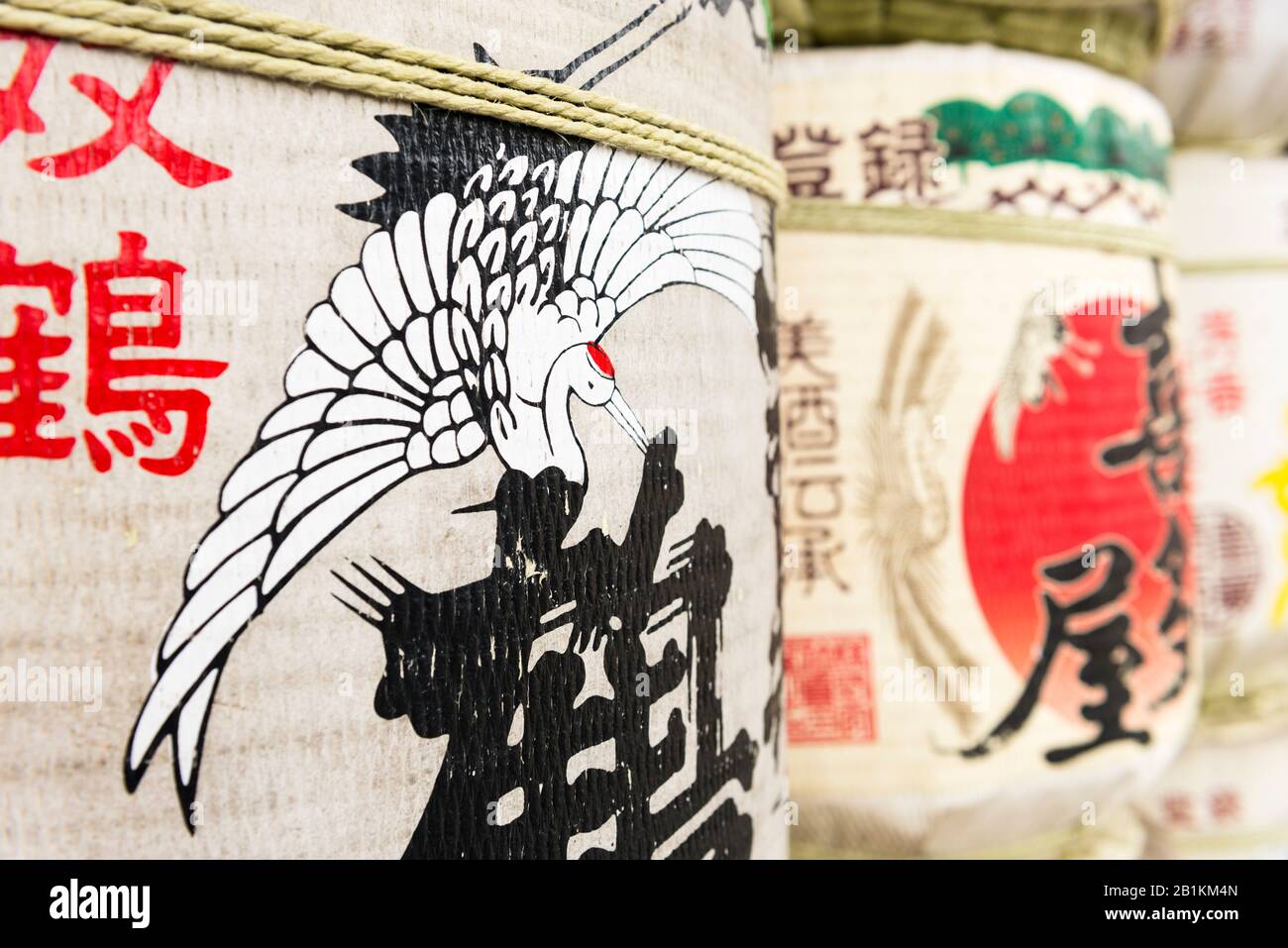 Sake barrels covered in Japanese art, including a flying stork, at ...
