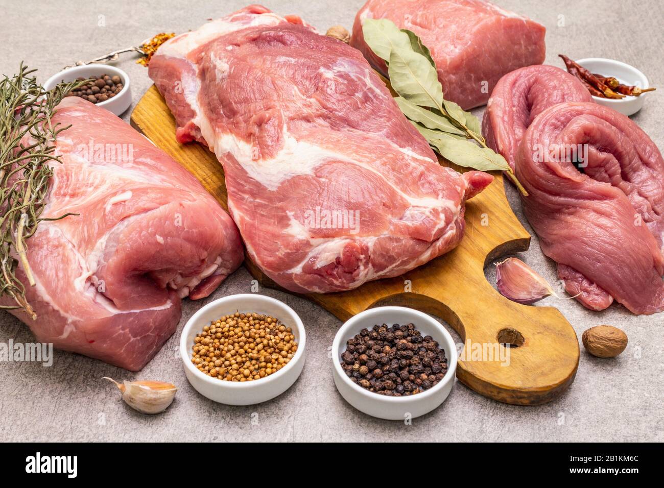 Assorted various fresh pork cuts. Raw meat with spices. Tenderloin ...