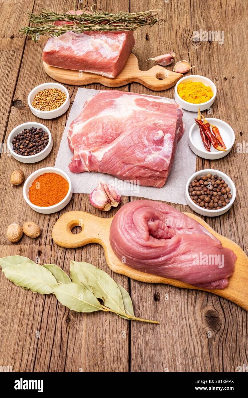 Assorted various fresh pork cuts. Raw meat with spices. Tenderloin ...