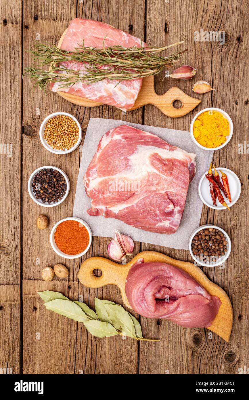 Assorted various fresh pork cuts. Raw meat with spices. Tenderloin ...