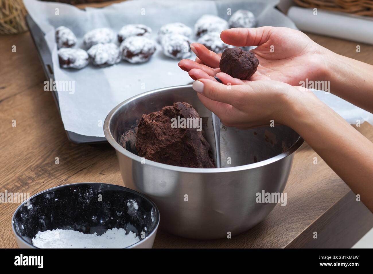 The process of baking brownie cookies. The photo shows female hands ...
