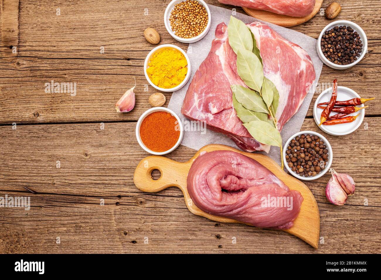 Assorted various fresh pork cuts. Raw meat with spices. Tenderloin ...