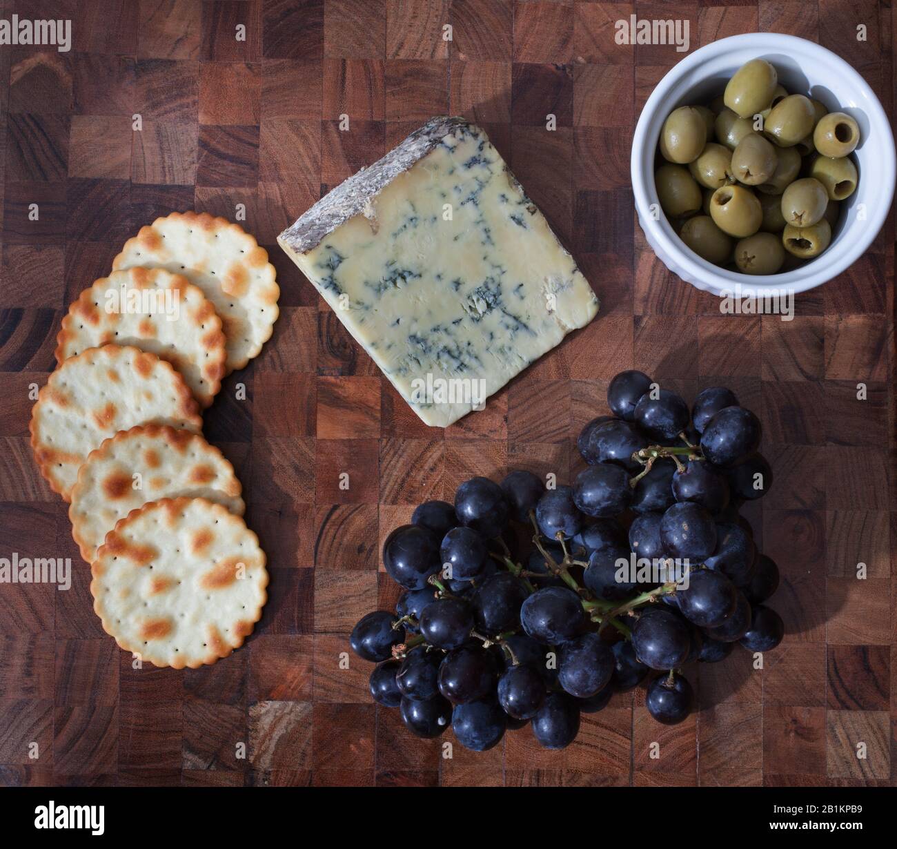 A platter of cheese and biscuits with fruit hi-res stock photography ...