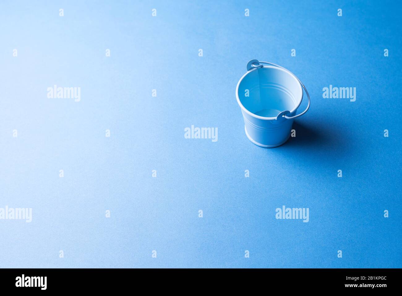 A metal garden bucket of blue color, miniature size. Classic blue ...