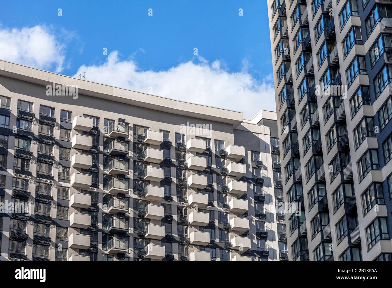 Modern high-rise buildings opposite a clear blue sky in perspective ...