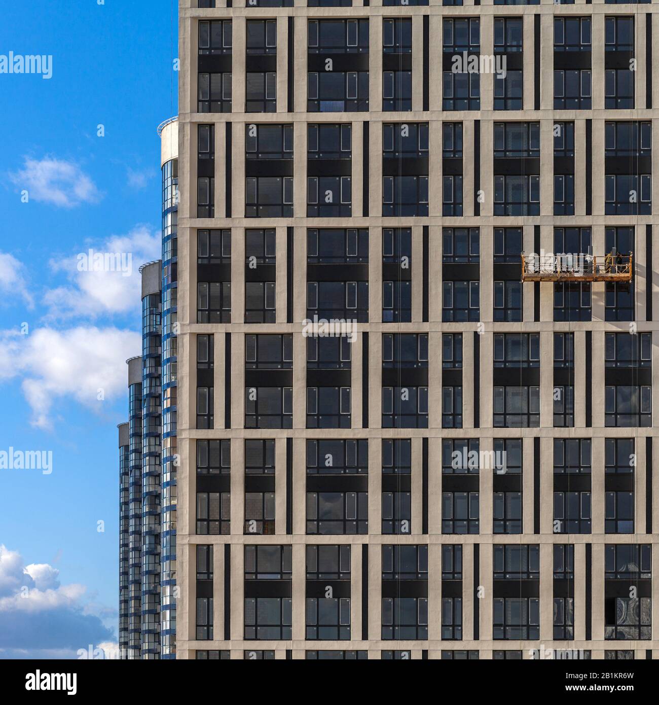 Modern high-rise buildings opposite a clear blue sky in perspective ...