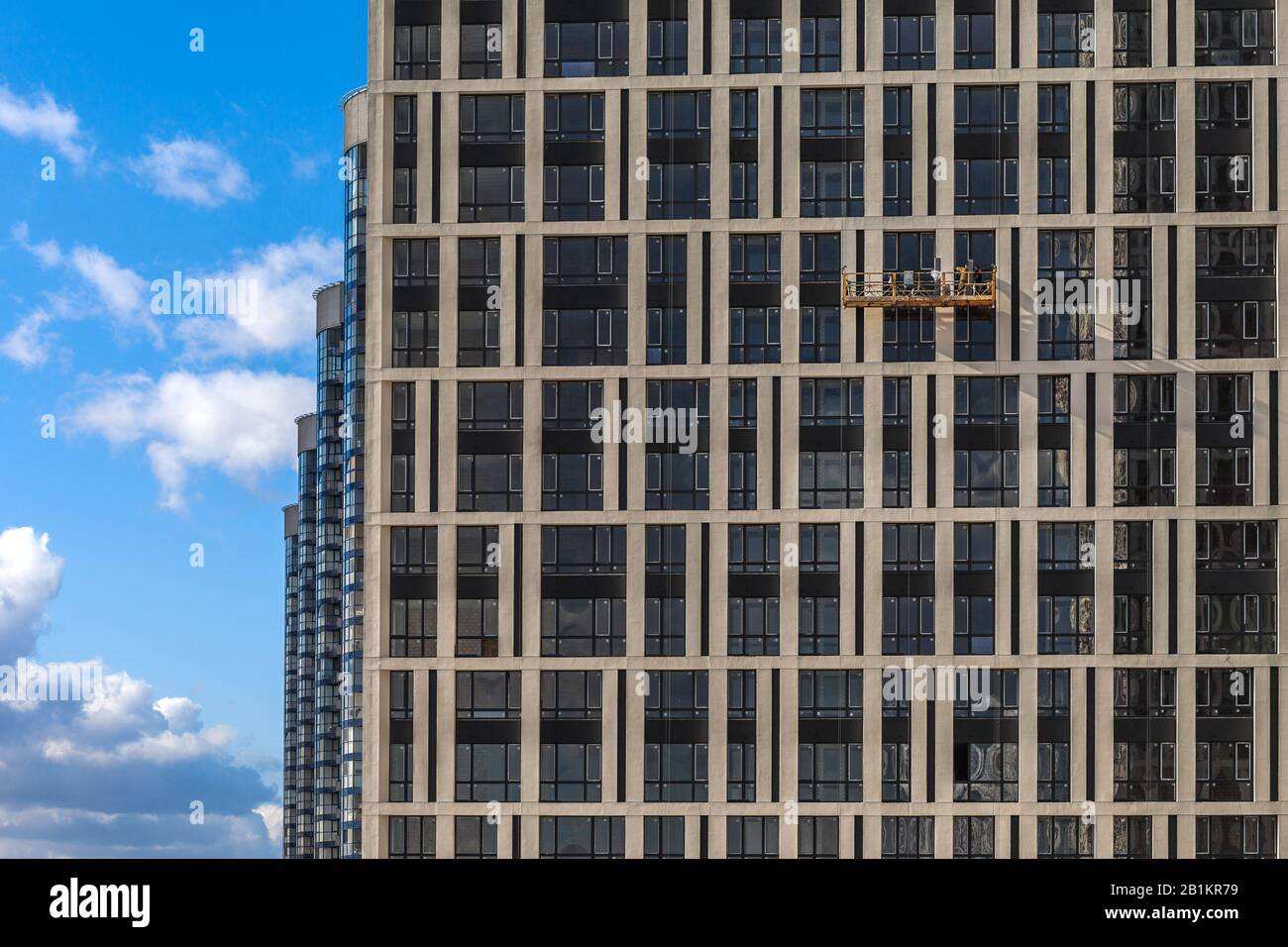 Modern high-rise buildings opposite a clear blue sky in perspective ...