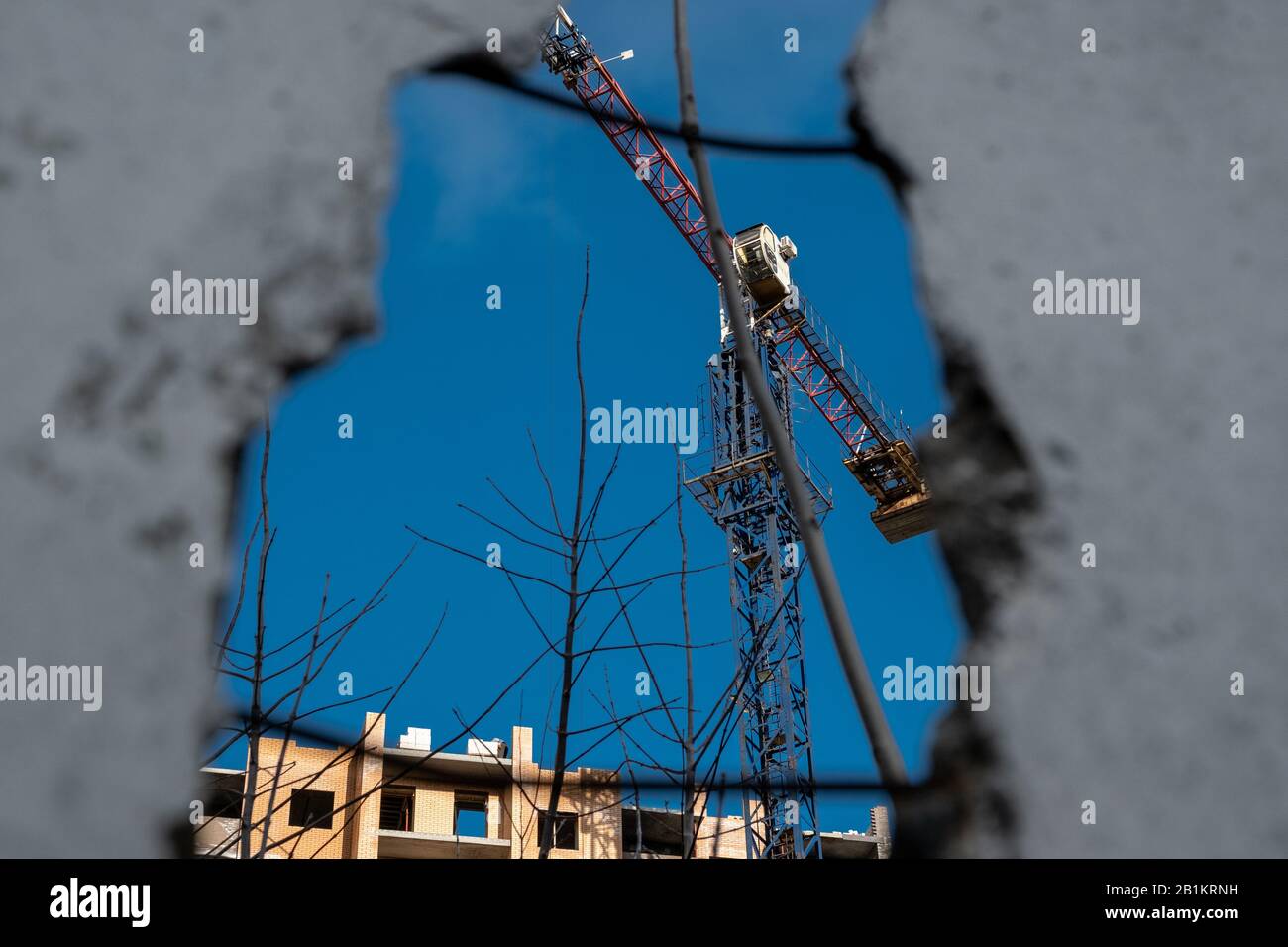 Crane on construction site. Crane and building under construction Stock ...