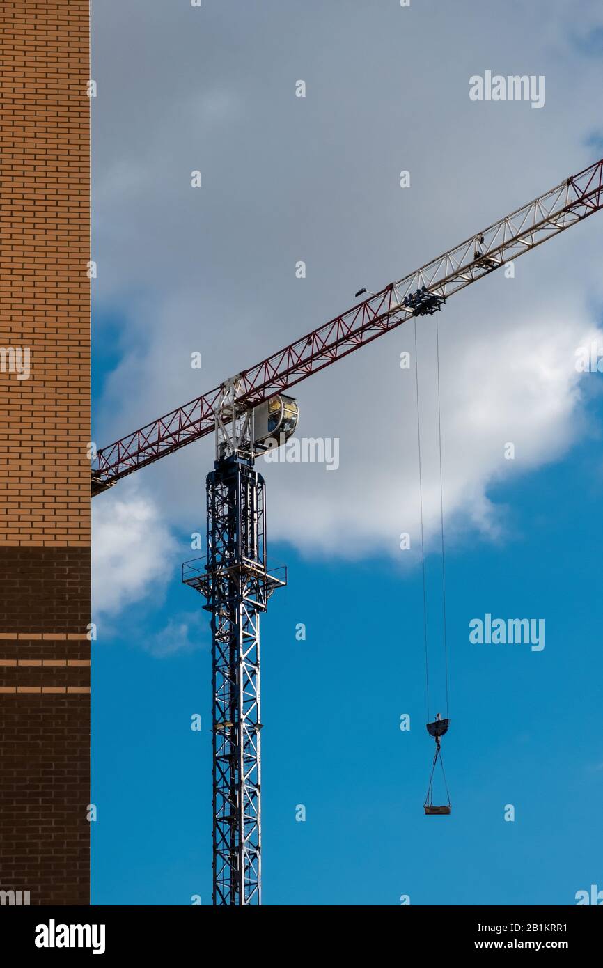 Building crane lifts building materials. Construction, building a house ...