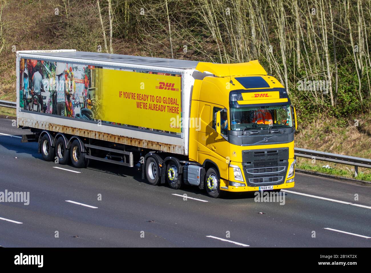 DHL yellow articulated Haulage delivery trucks, lorry, transportation ...