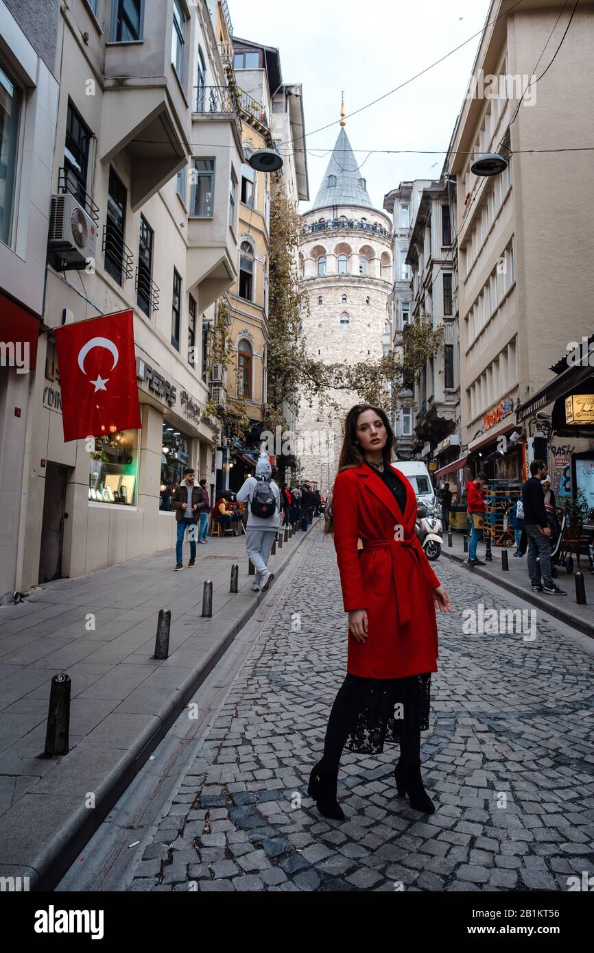 Portrait of beautiful woman with view of Galata tower in Istanbul ...