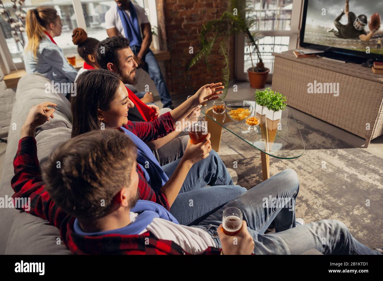 People Watching American Football On Tv