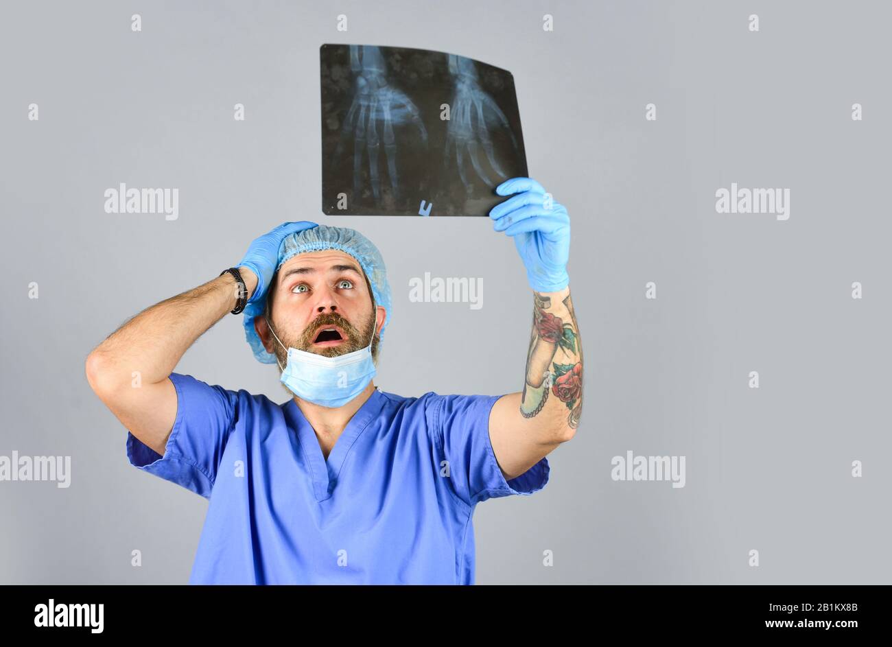 Doctor examines radiographic snapshot of wrist. Surgeon estimate ...