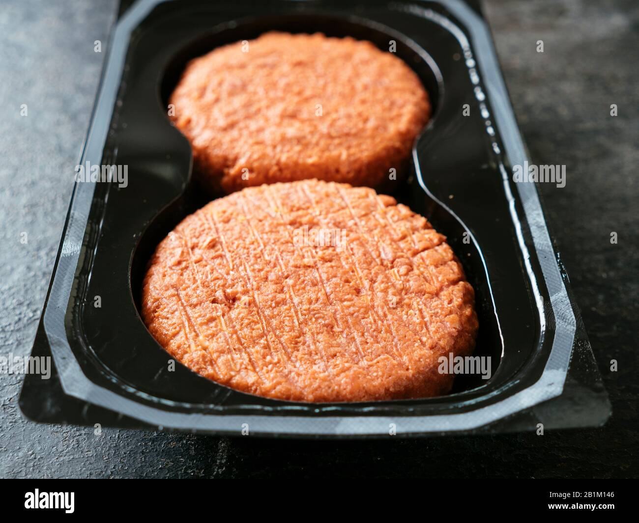 Two soy protein based vegan burgers Stock Photo - Alamy