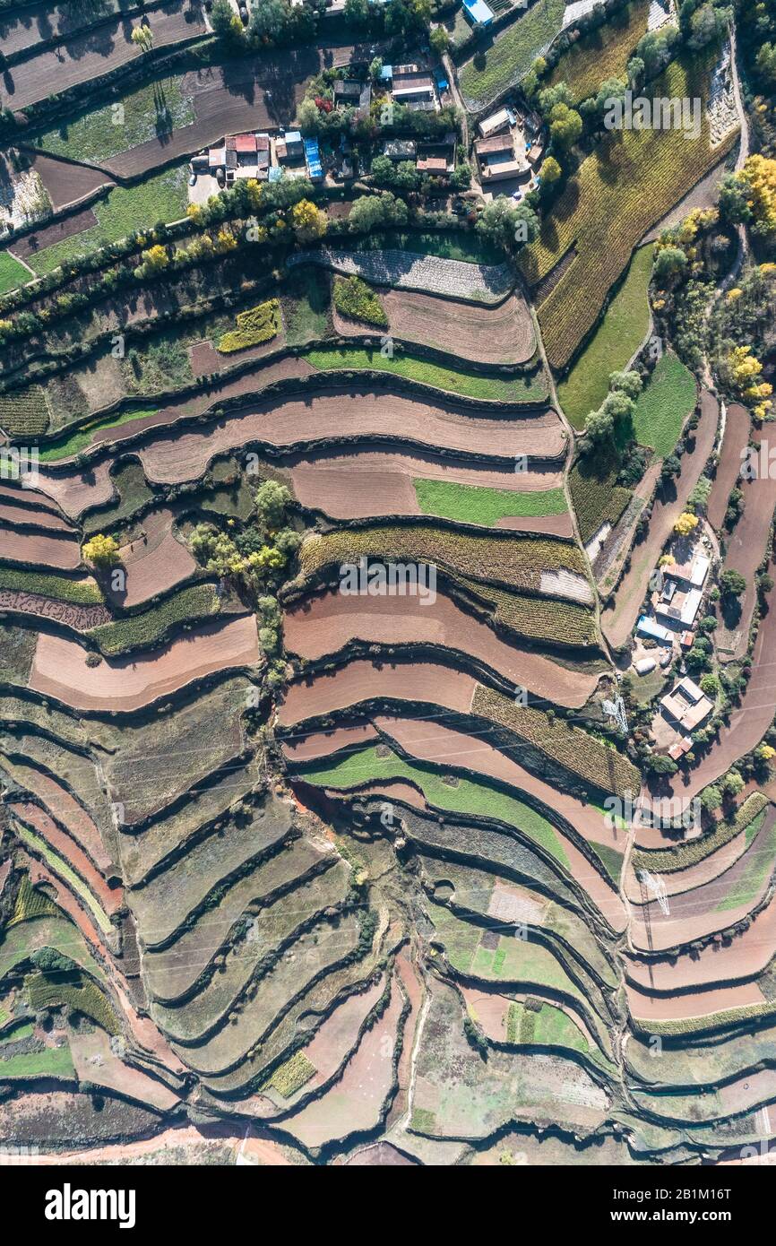 aerial view of terraced fields and villages from above. Qinghai, China ...