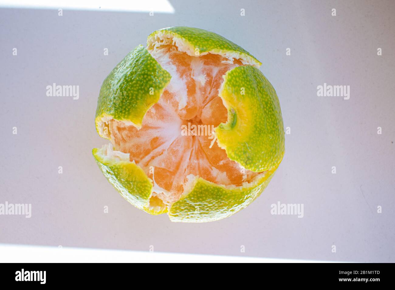 Green mandarin isolated on white background. Clipping path Stock Photo ...