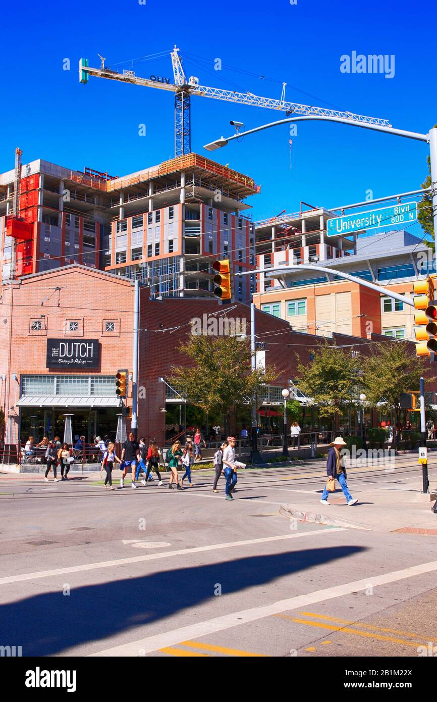 People crossing the street near the Main Gate of the University of ...