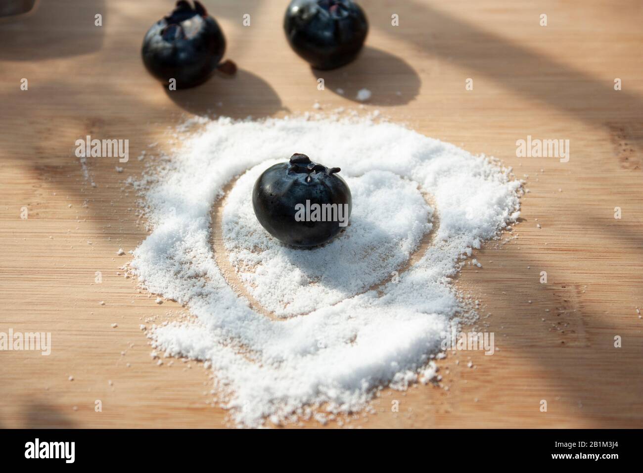 blueberry in the middle of a heart formed with sugar-free granules ...