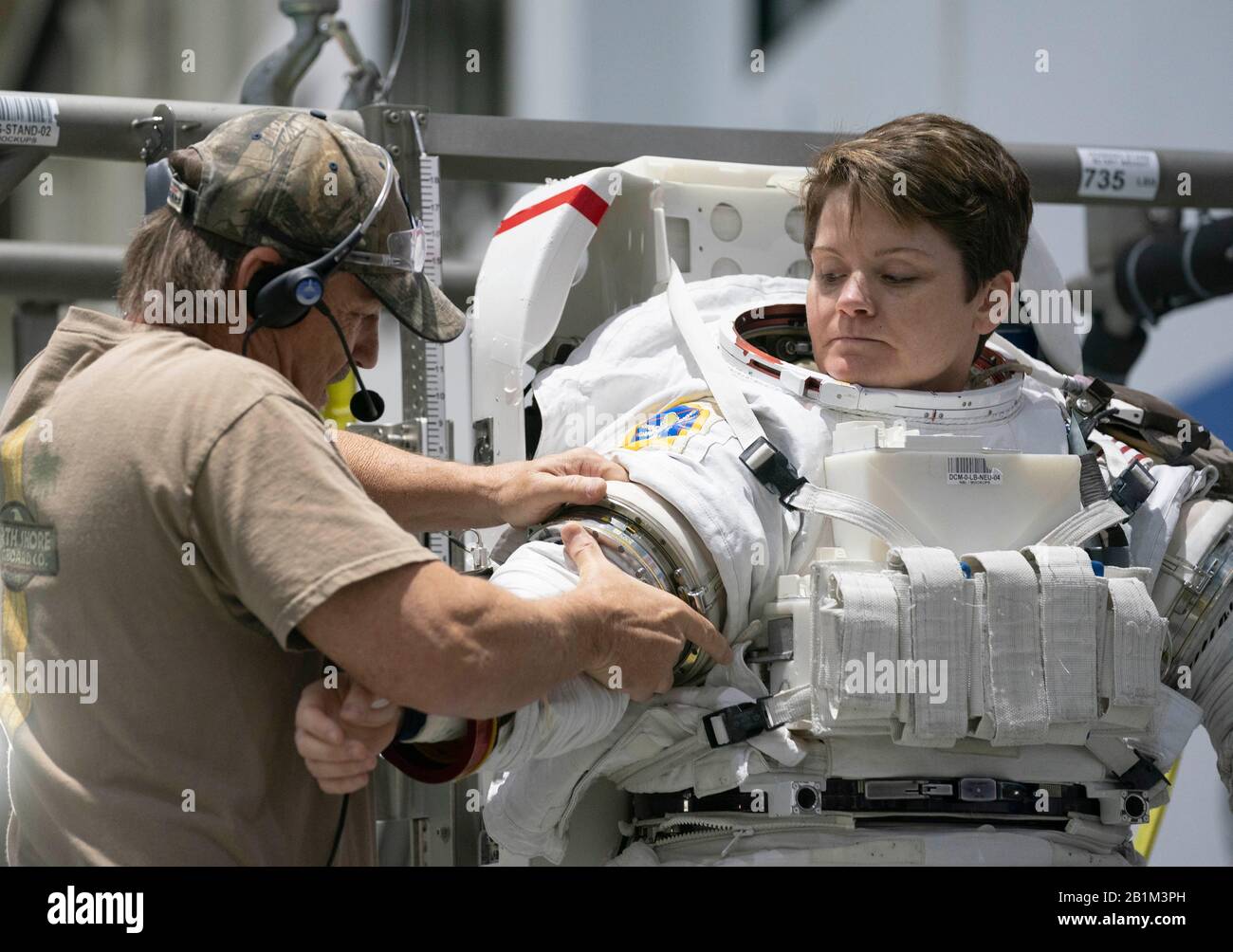 Veteran astronaut Anne C. McClain suits up in NASA's Neutral Buoyancy ...