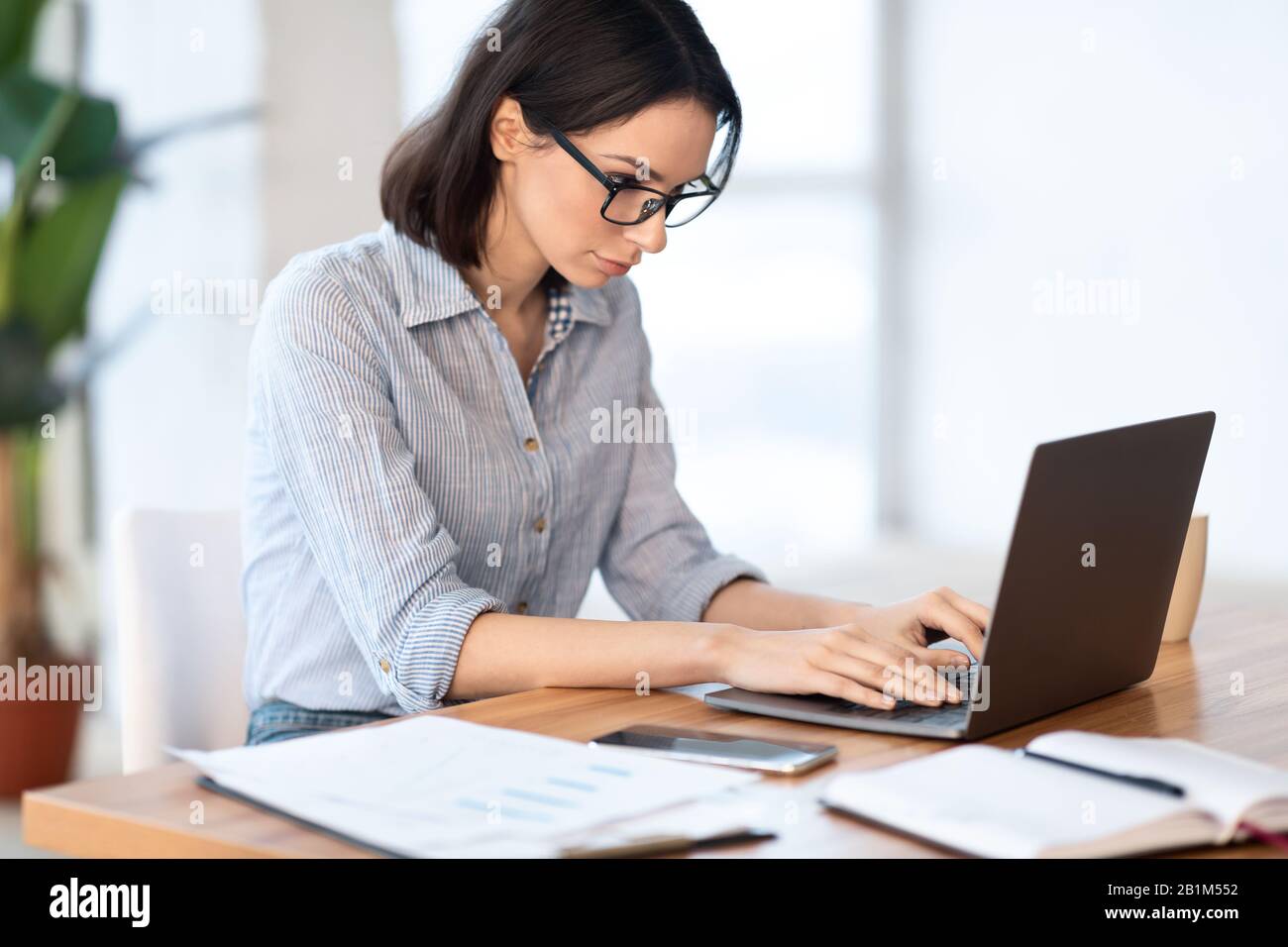 Woman using personal computer at her home Stock Photo - Alamy