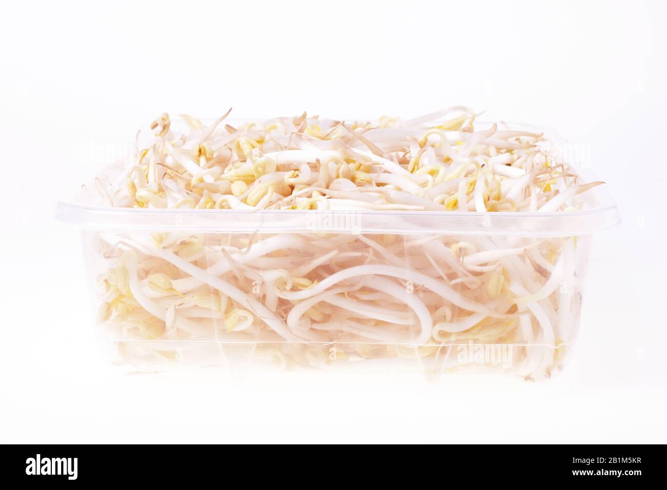 Fresh soy bean sprouts in plastic tableware isolated on white ...