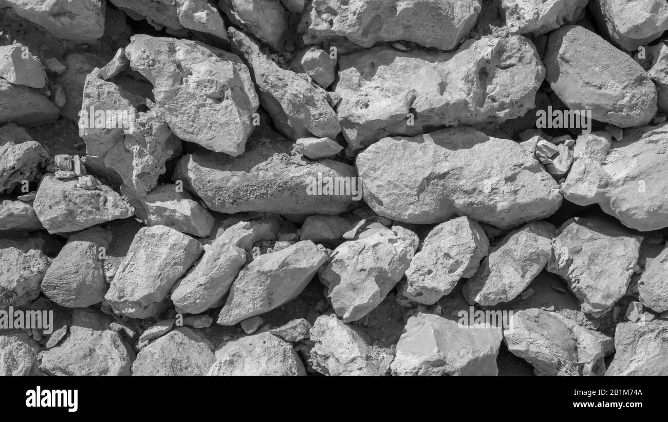 Background image of traditional arab stone wall with multiple stones ...