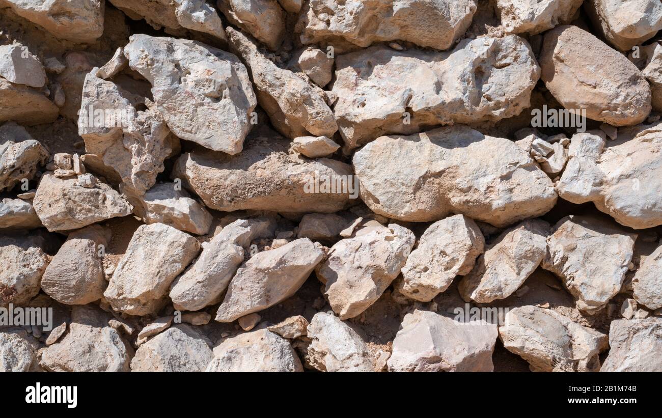 Background image of traditional arab stone wall with multiple stones Stock Photo - Alamy