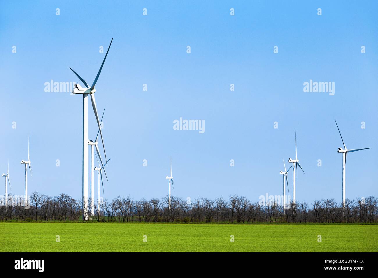 Wind turbines move to generate energy. Clean wind power concept Stock ...