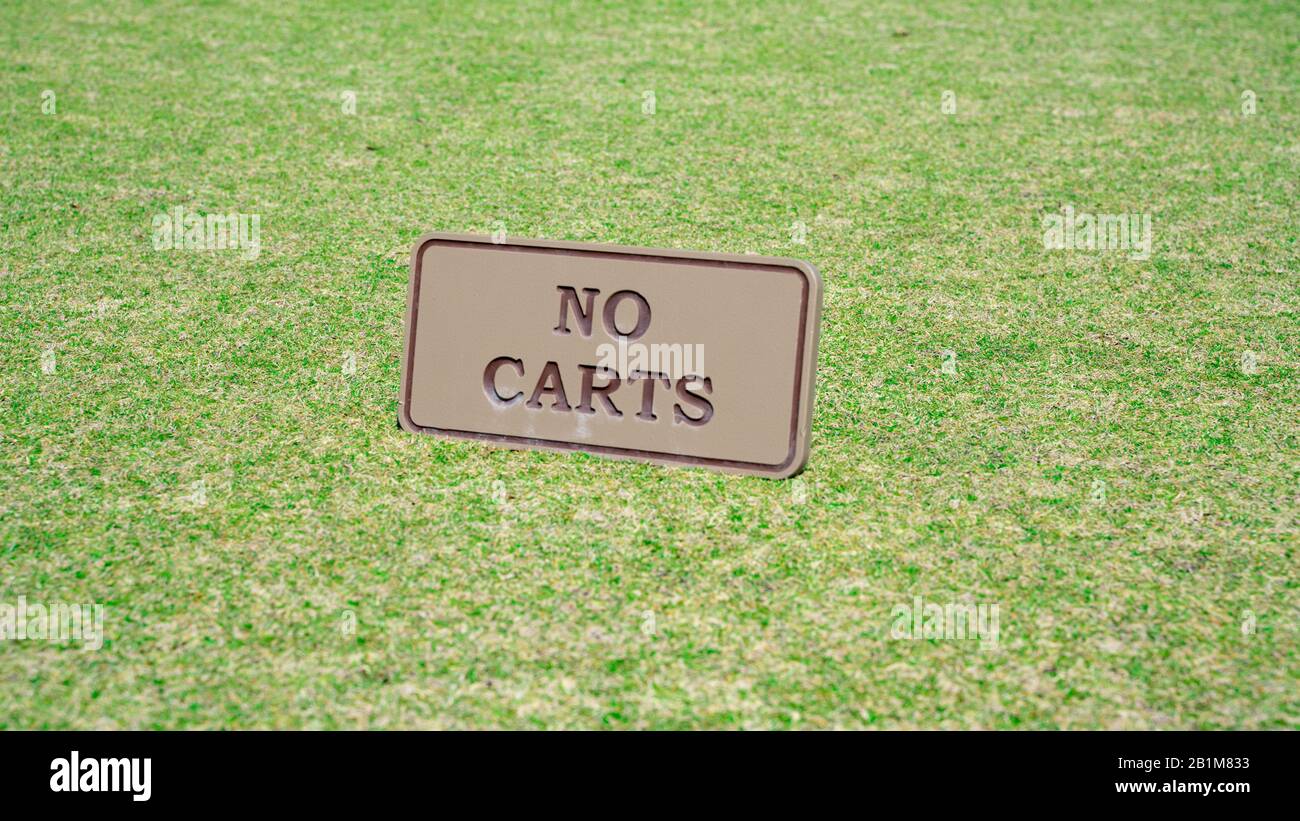 Background image of wood no carts sign board on a golf course Stock ...