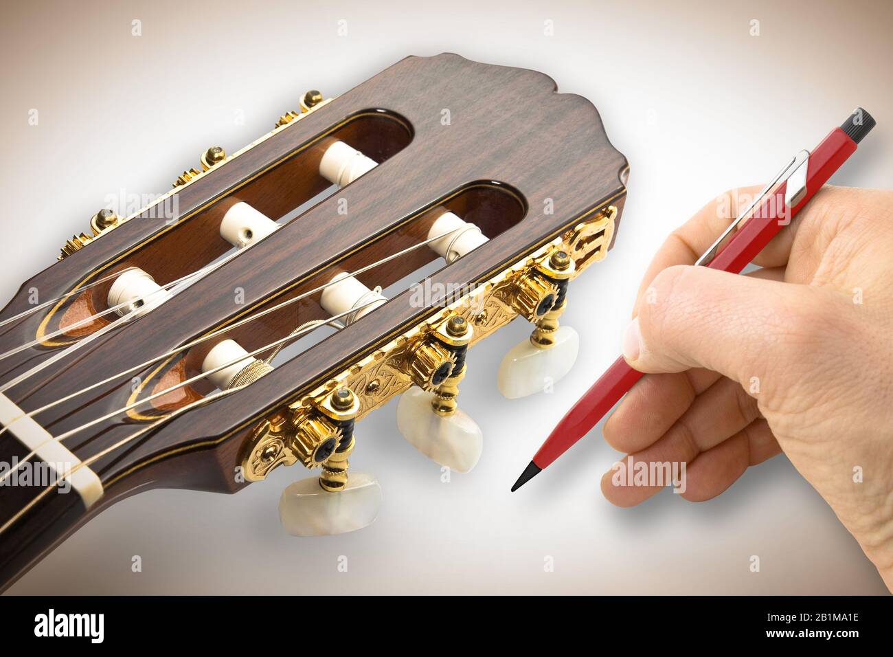 Hand writing above a background with acoustic classical guitar Stock ...