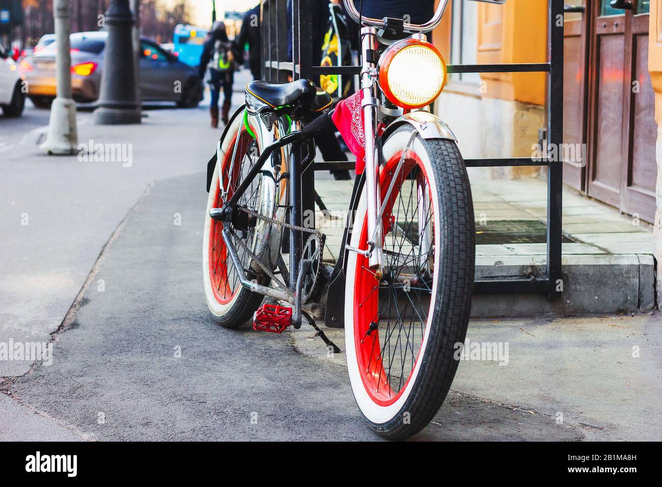 vintage red bike parked on the street Stock Photo - Alamy