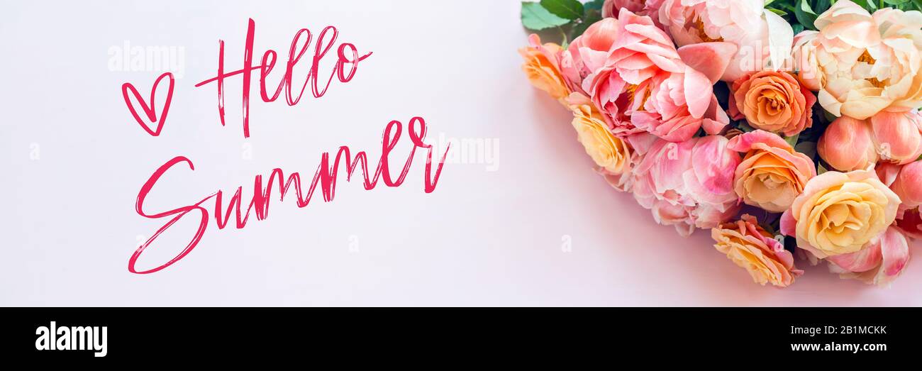 Hello Summer words. Fresh bunch of pink peonies and roses on pink ...