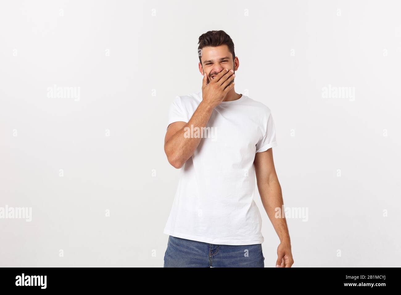 Charming handsome. Handsome young man in casual wear while standing ...