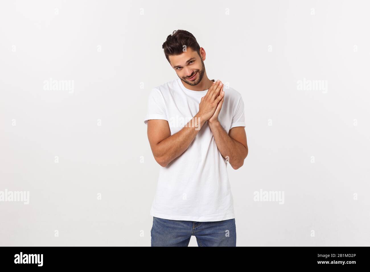 Charming handsome. Handsome young man in casual wear while standing ...