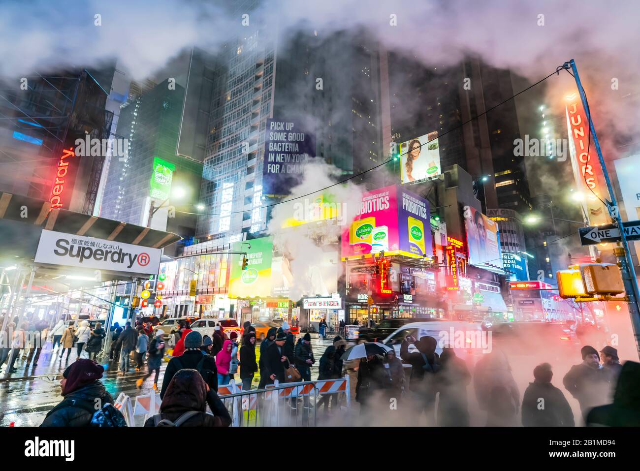 The steam surrounds people and traffic around Times Square intersection ...