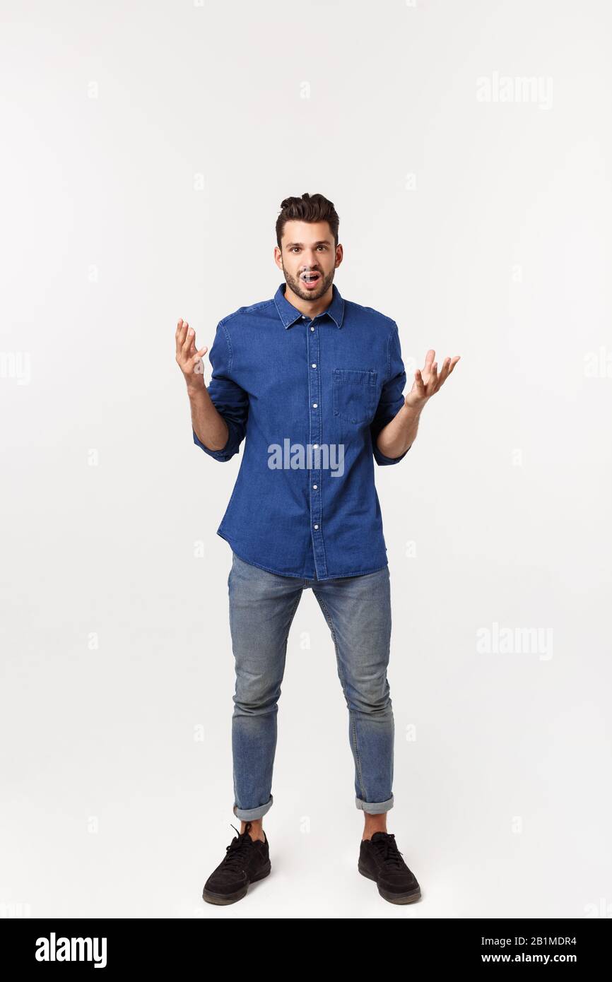 Charming handsome. Handsome young man in casual wear while standing ...