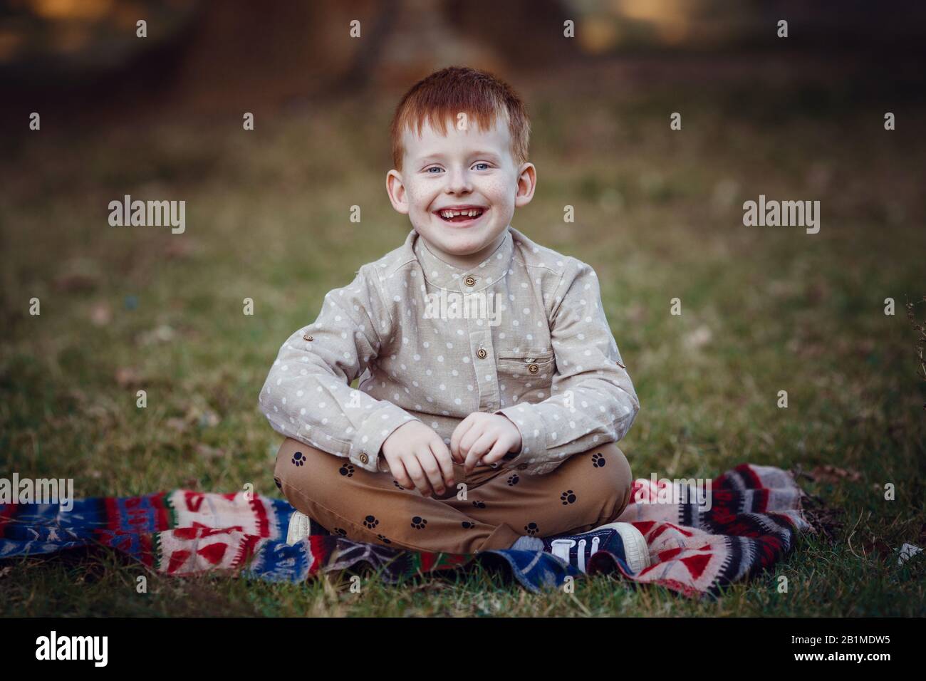 A series of photos of red-haired children. Girl and boy in nature ...