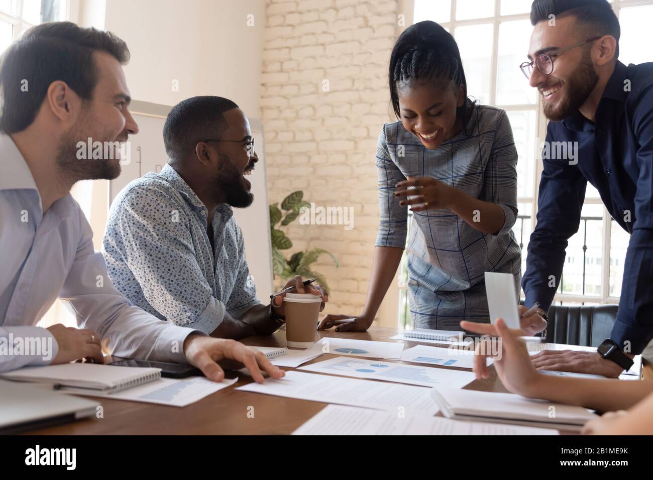 Colleagues analyzing documents in hi-res stock photography and images ...